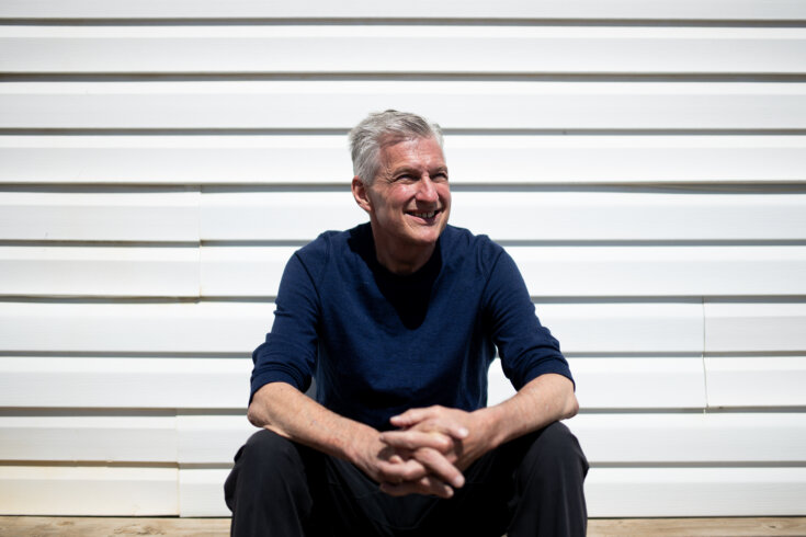 A photo of Bruce Fanjoy sitting against a white background