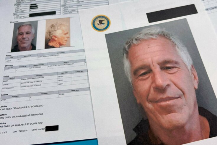 Photo of documents from the Epstein files, including a large picture of ...