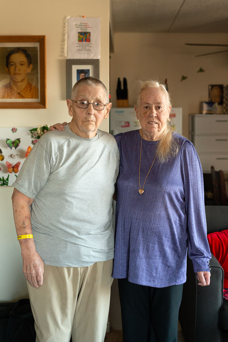 Photo of Betty and Allan Bellchambers at home. There is a photo of ...